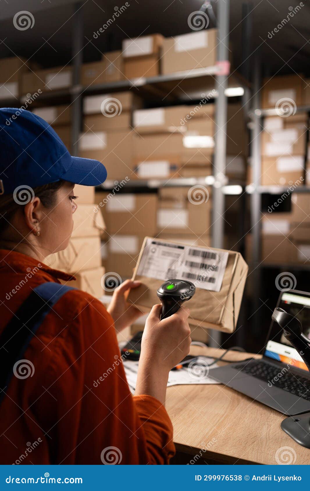 Warehouse Worker Scanning Barcode on Parcel Using Barcode Scanner ...