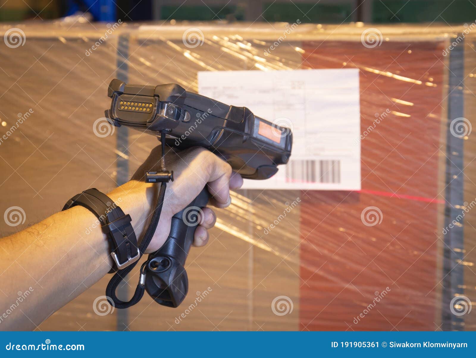 Warehouse Worker Scanning Barcode Scanner on Label of Shipment Product ...