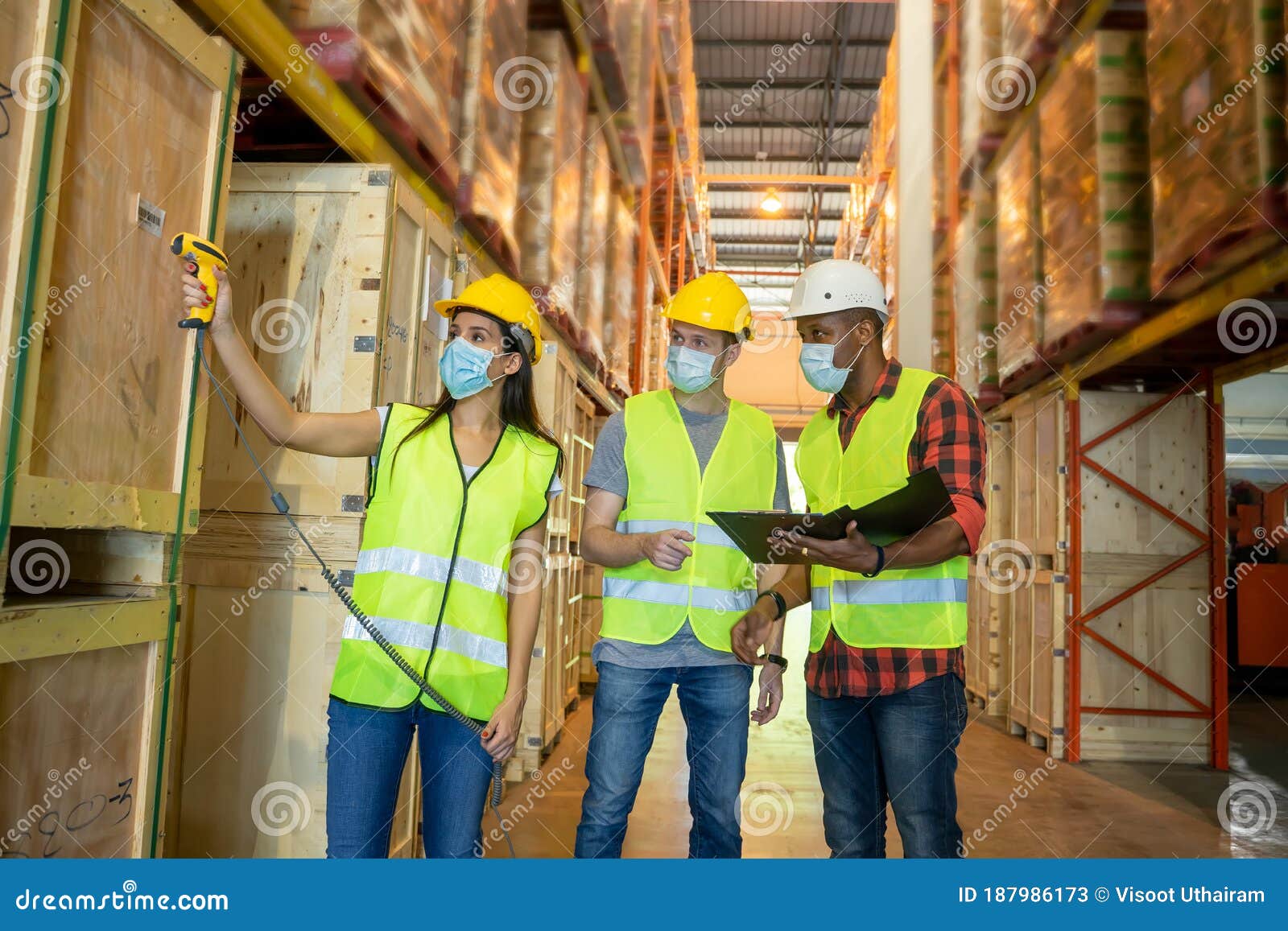 Warehouse Worker Scanning Barcodes on Boxes in a Large Warehouse Stock ...