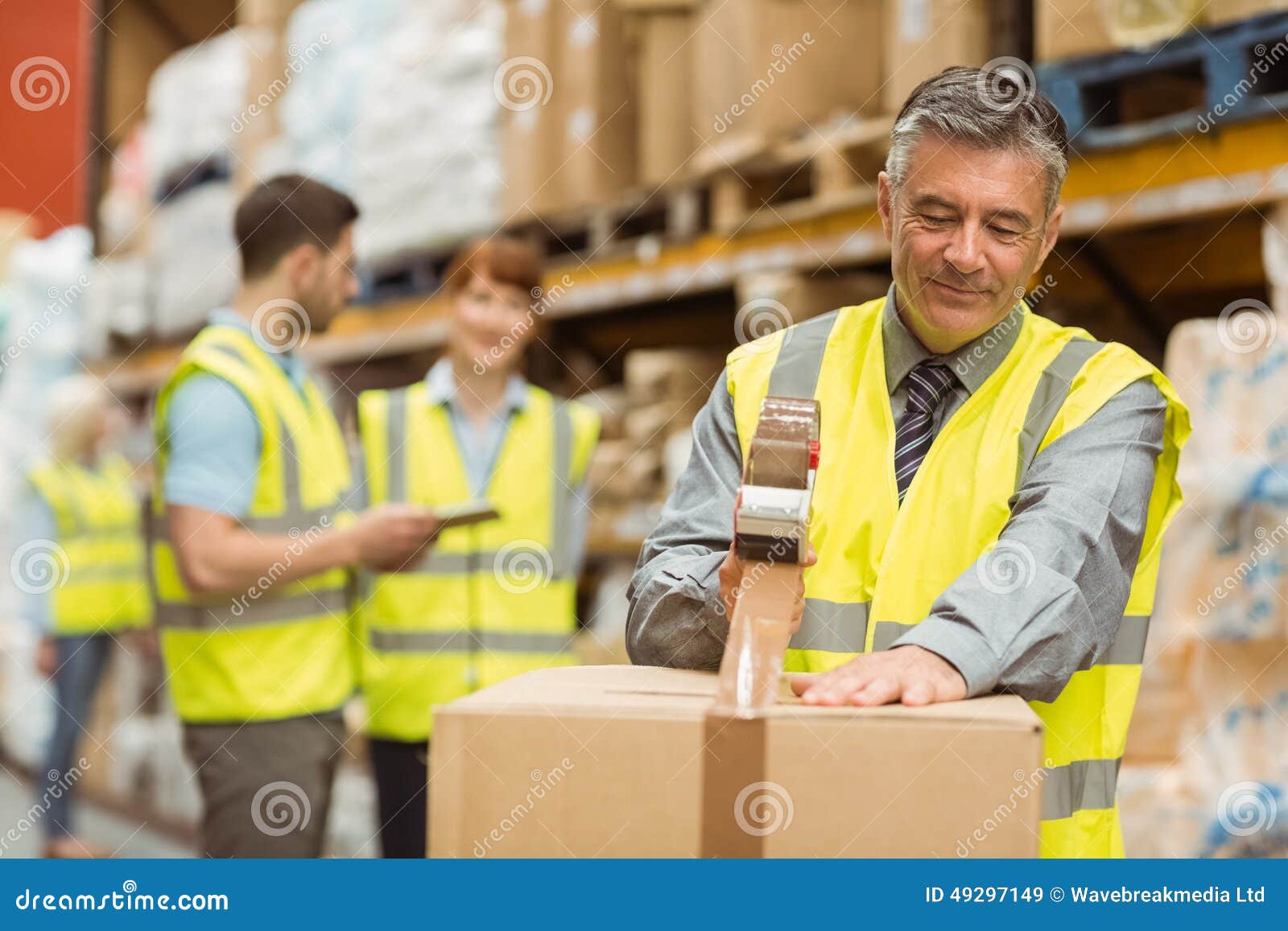 Warehouse Worker Sealing Cardboard Boxes for Shipping Stock Image ...