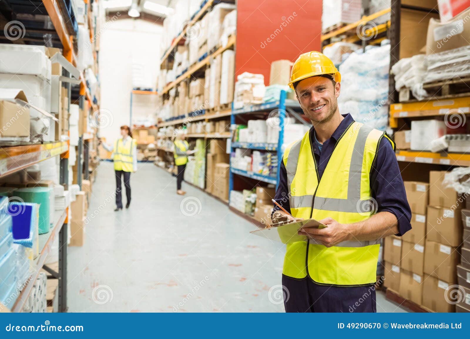 Warehouse Worker Smiling at Camera with Clipboard Stock Photo - Image ...