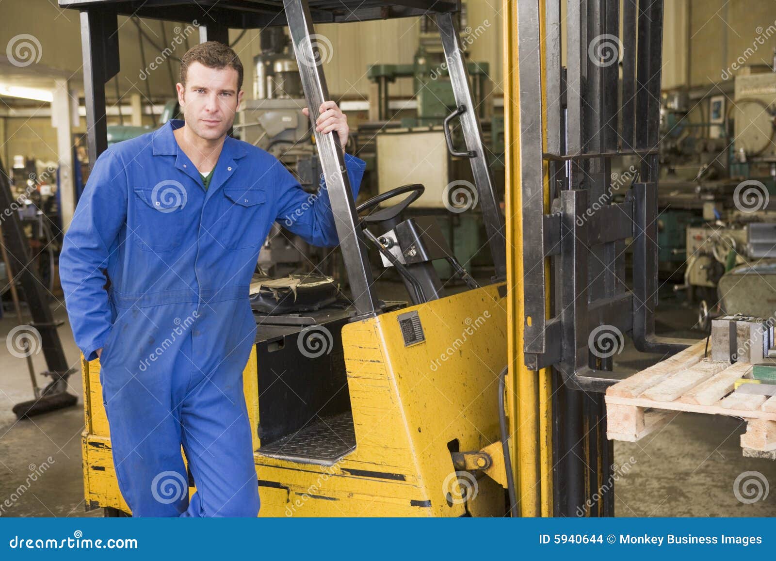 Warehouse Worker Standing by Forklift Stock Photo - Image of labour ...