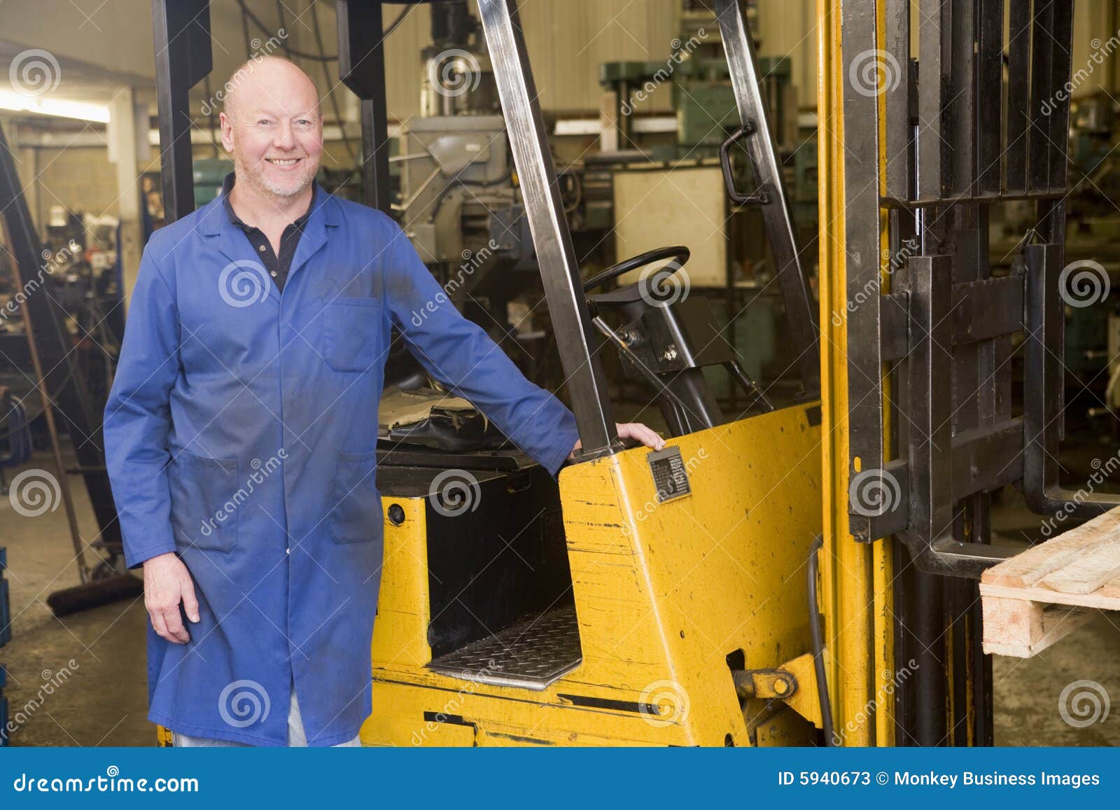 Warehouse Worker Standing by Forklift Stock Image - Image of daytime ...