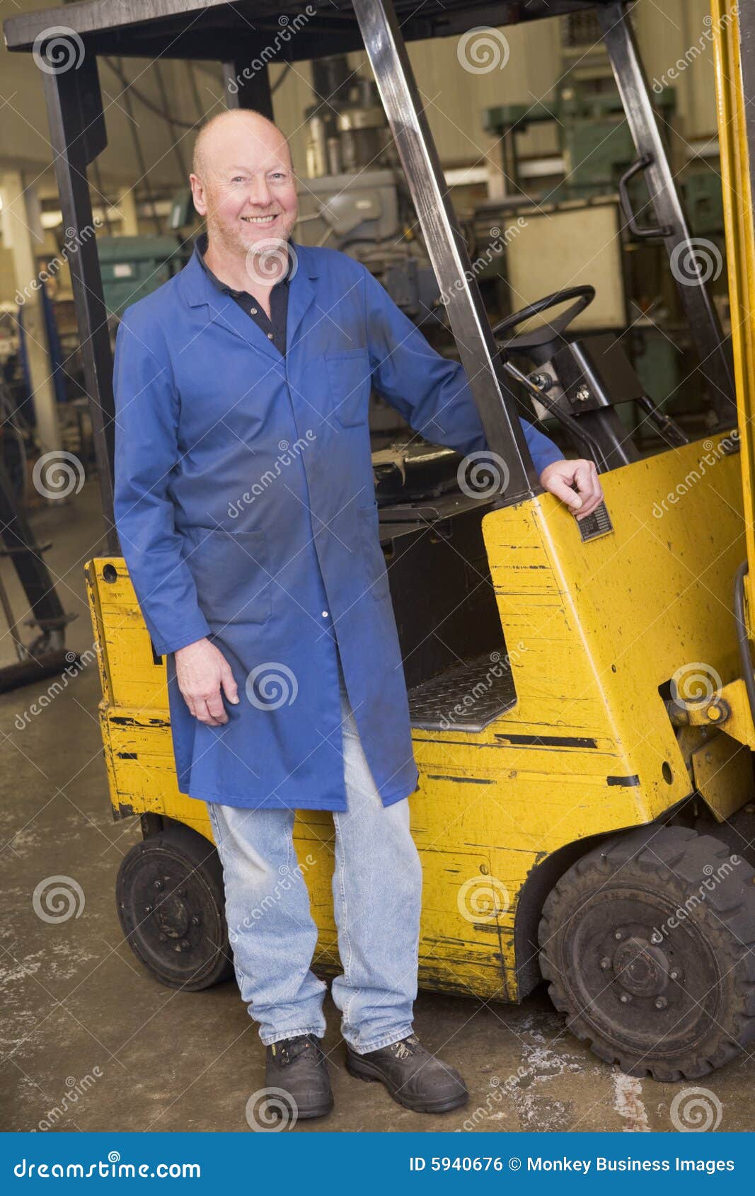 Warehouse Worker Standing by Forklift Stock Photo - Image of factory ...