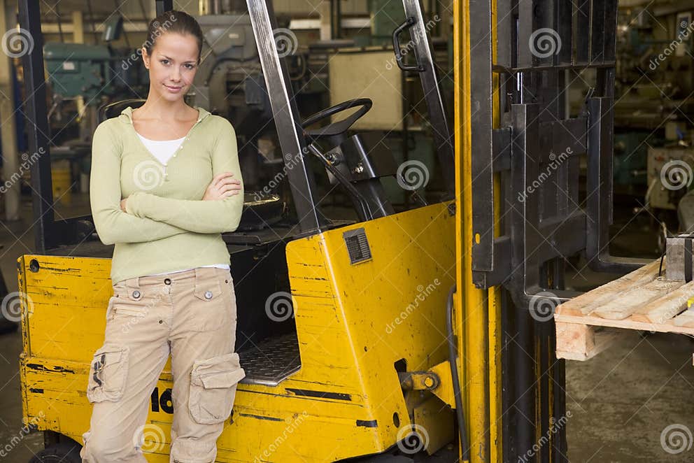Warehouse Worker Standing by Forklift Stock Photo - Image of laborer ...