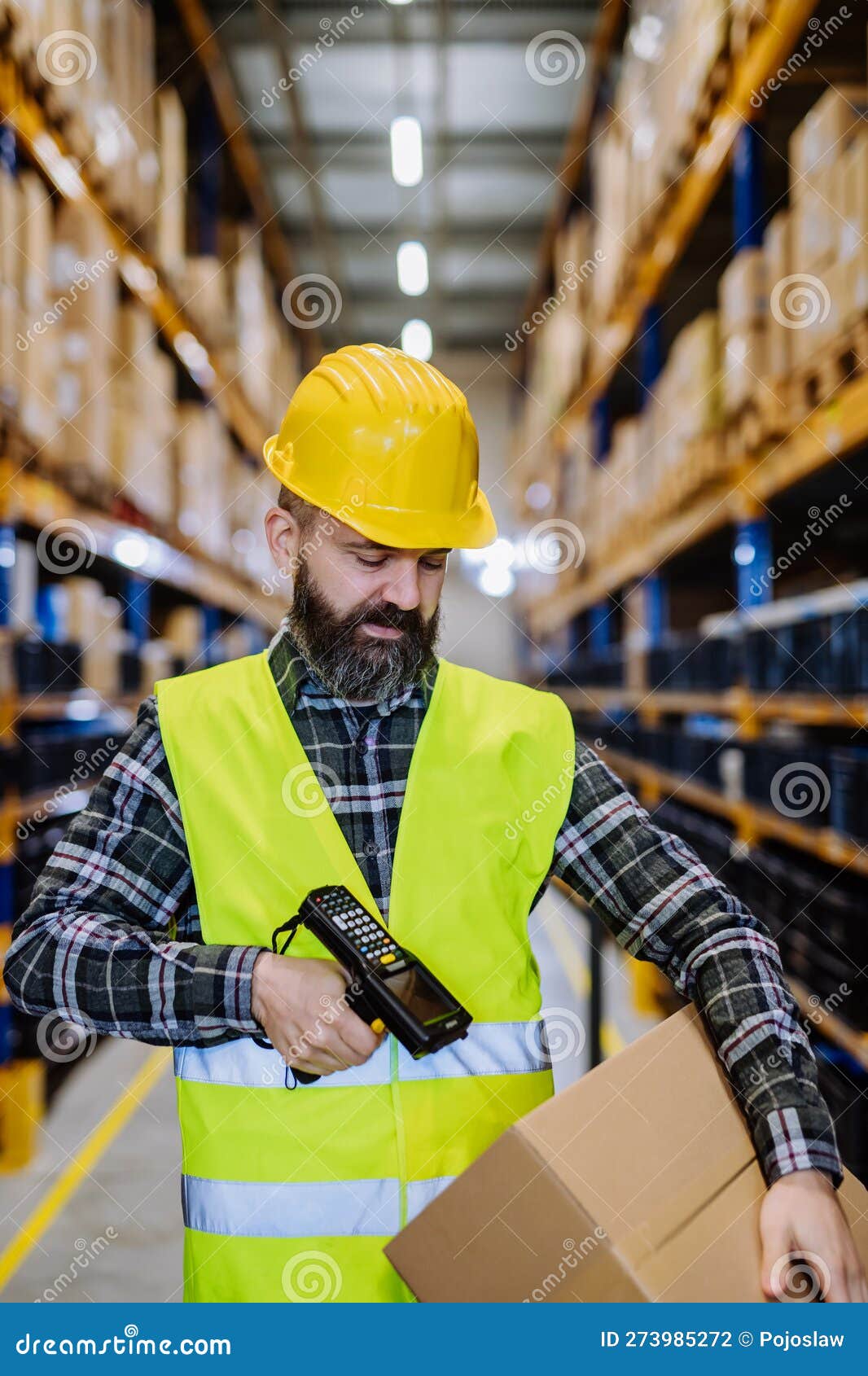 Warehouse Worker Stocking Goods in a Warehouse. Stock Photo - Image of ...