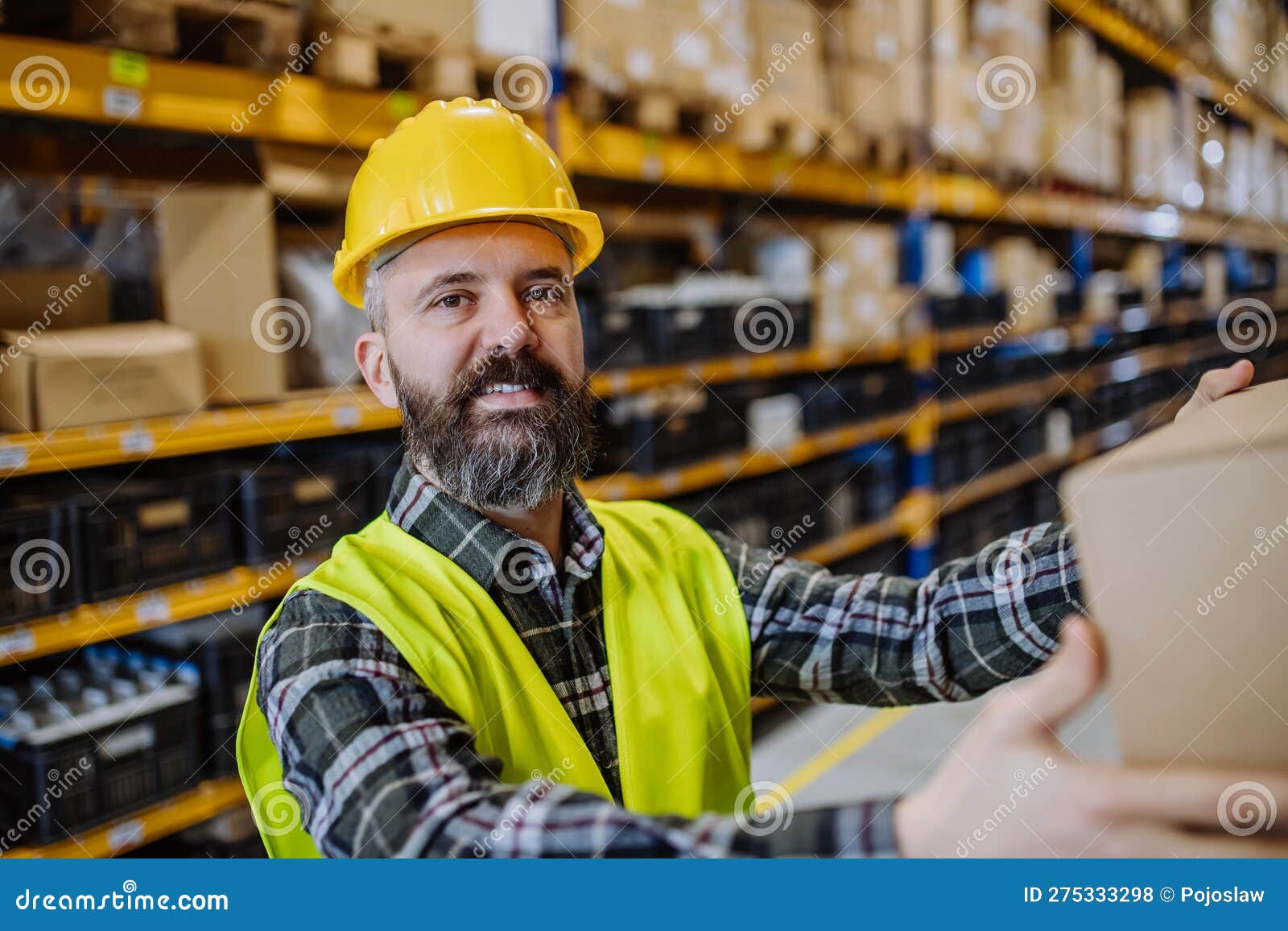 Warehouse Worker Stocking Goods in a Warehouse. Stock Photo - Image of ...