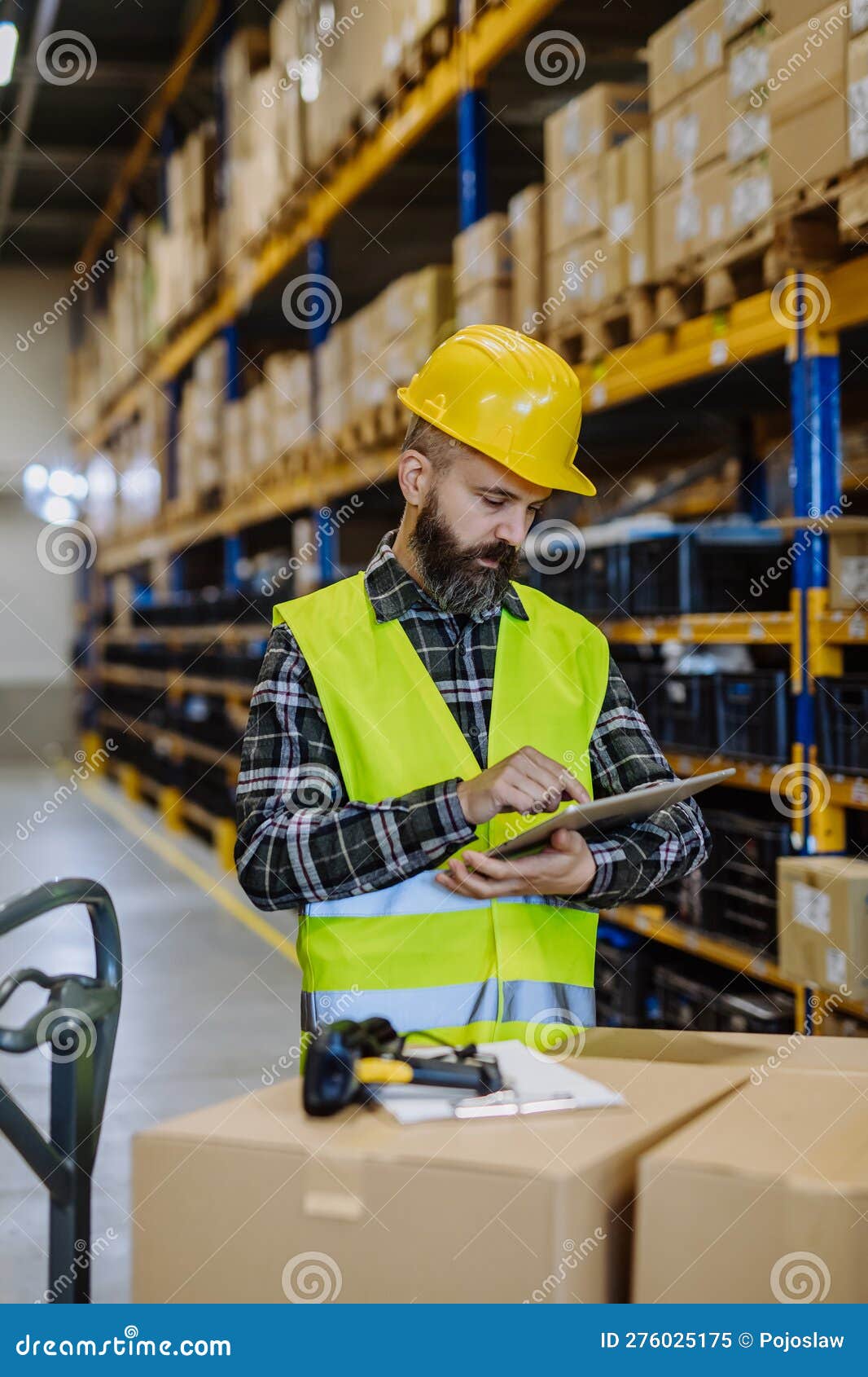 Warehouse Worker Stocking Goods in a Warehouse. Stock Image - Image of ...