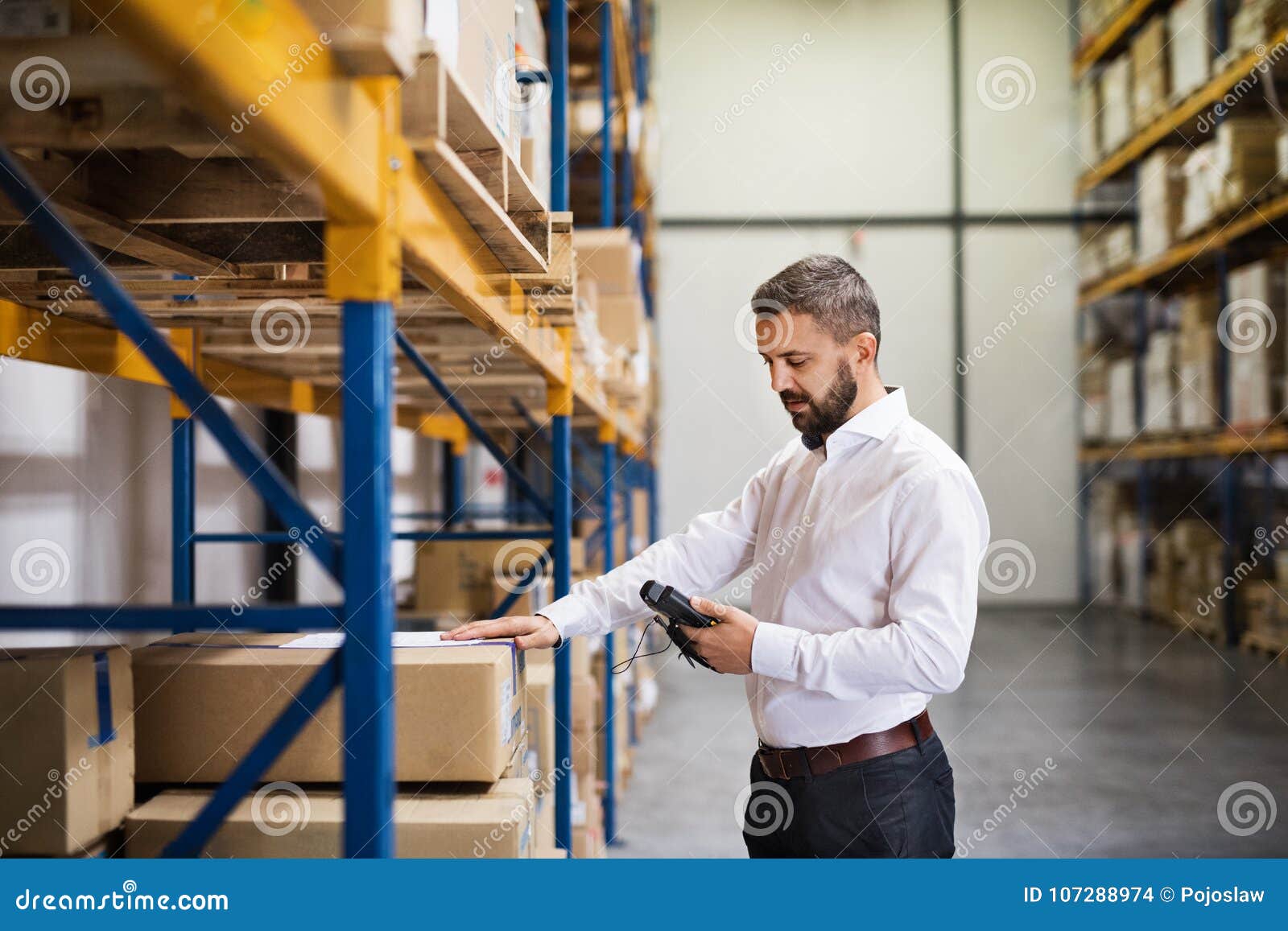 Warehouse Worker or Supervisor with Barcode Scanner. Stock Photo ...