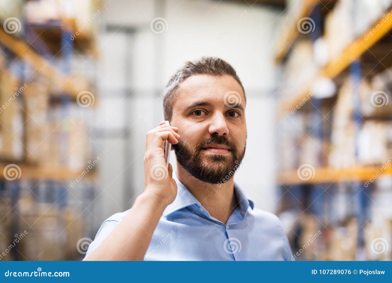 Warehouse Worker or Supervisor with a Smartphone. Stock Photo - Image ...