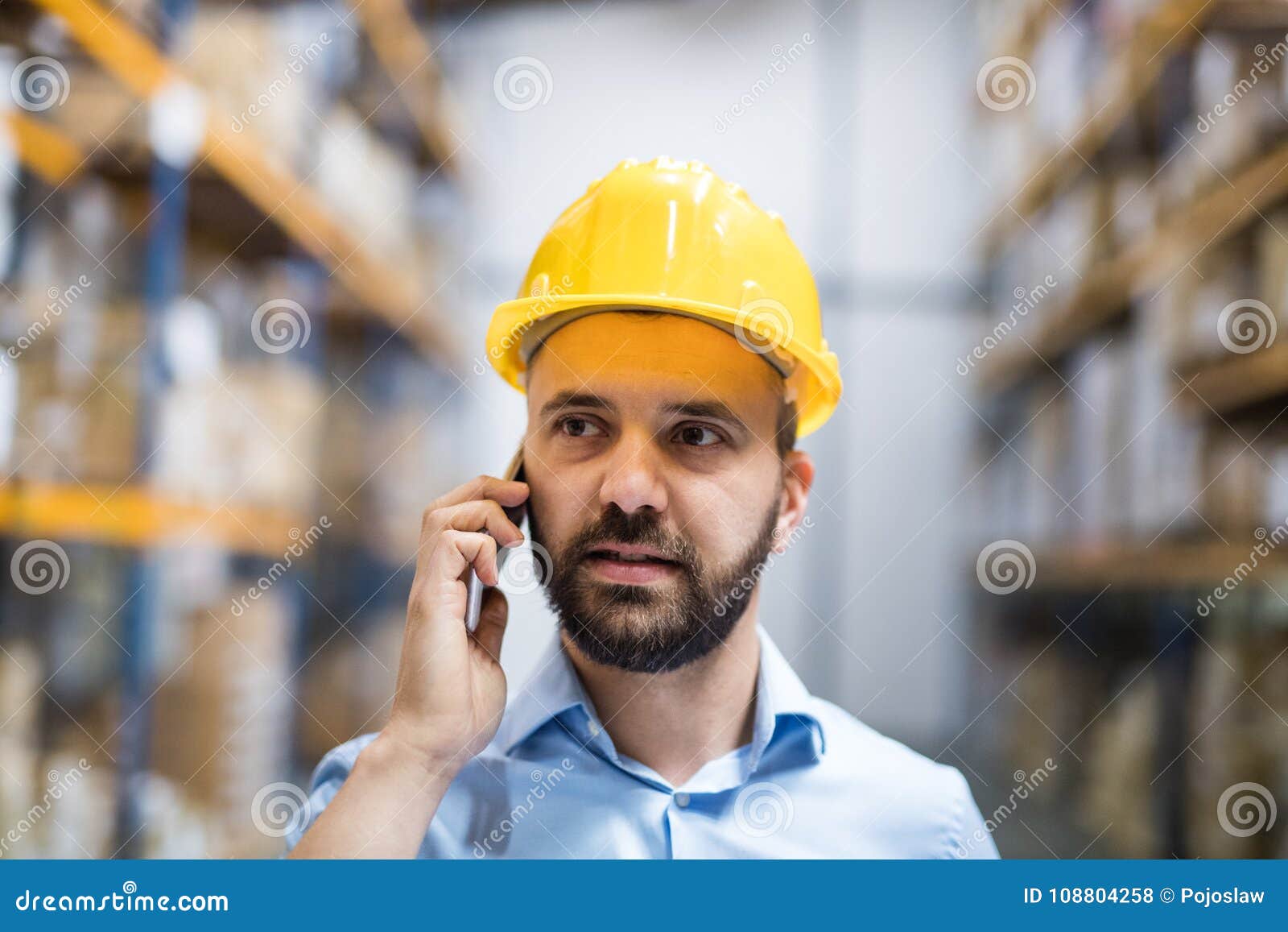 Warehouse Worker or Supervisor with a Smartphone. Stock Photo - Image ...