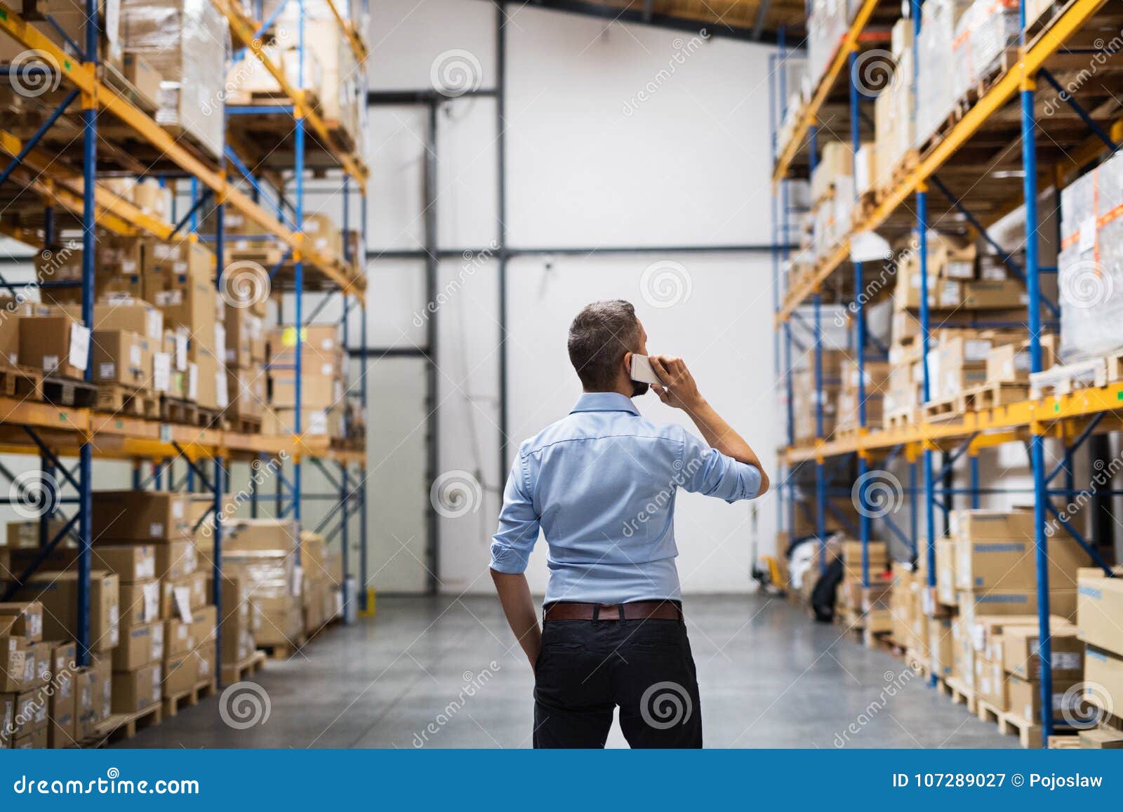 Warehouse Worker or Supervisor with a Smartphone. Stock Image - Image ...
