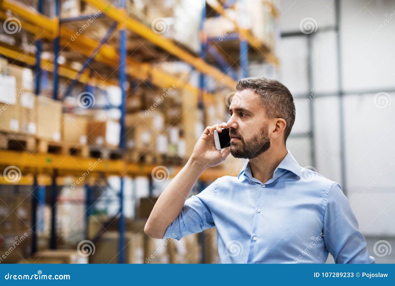 Warehouse Worker or Supervisor with a Smartphone. Stock Image - Image ...