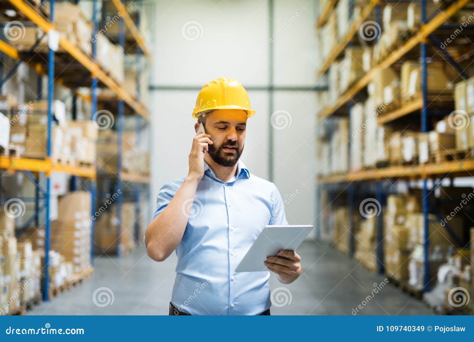 Warehouse Worker or Supervisor with a Smartphone. Stock Image - Image ...