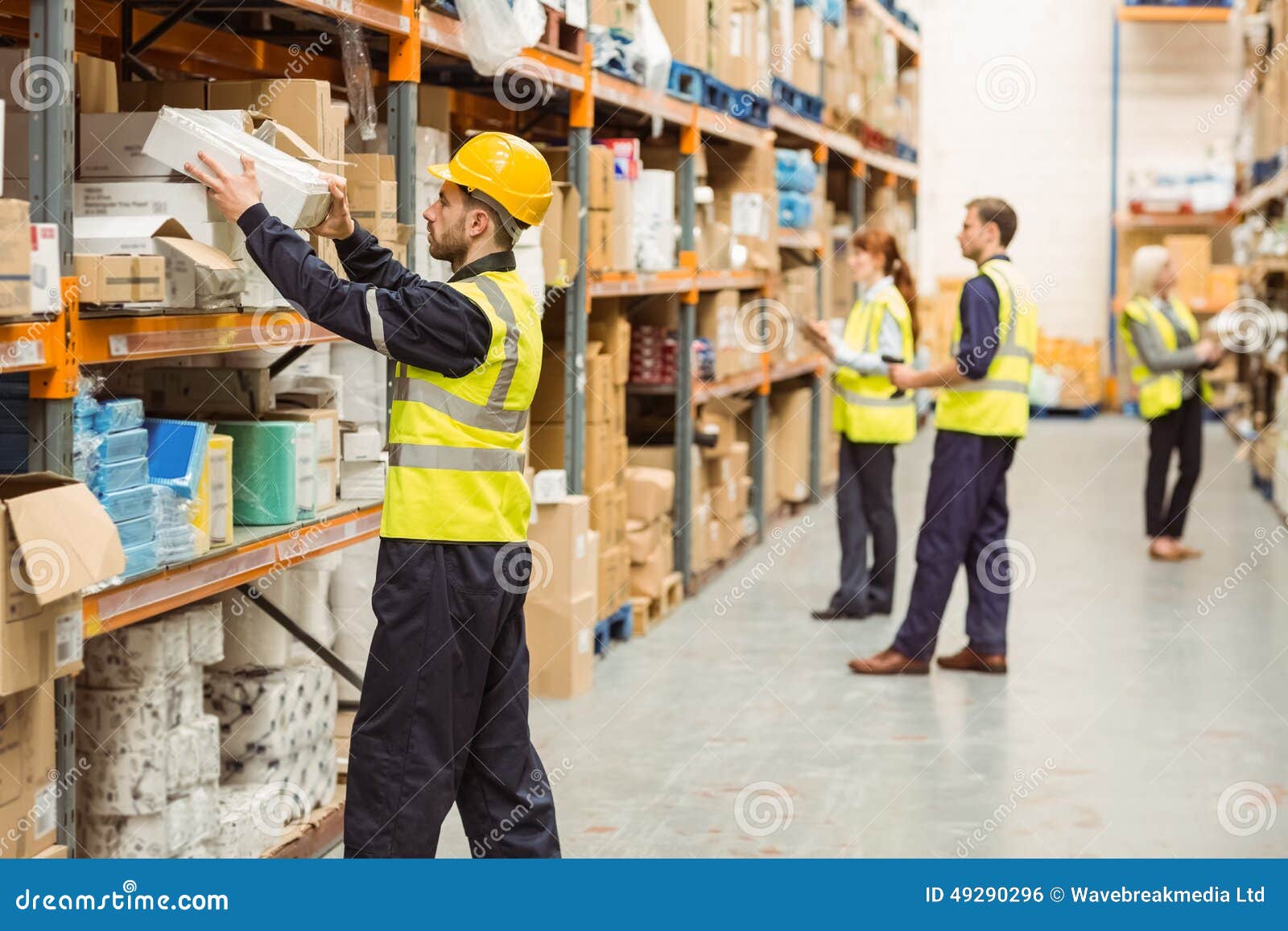 Warehouse Worker Taking Package in the Shelf Stock Photo - Image of ...