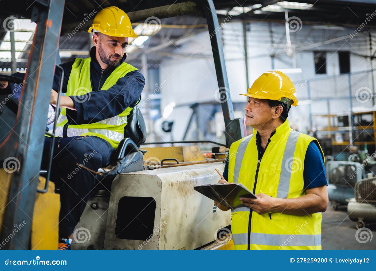 Warehouse Worker Talking with Forklift Operator in Factory Stock Photo ...