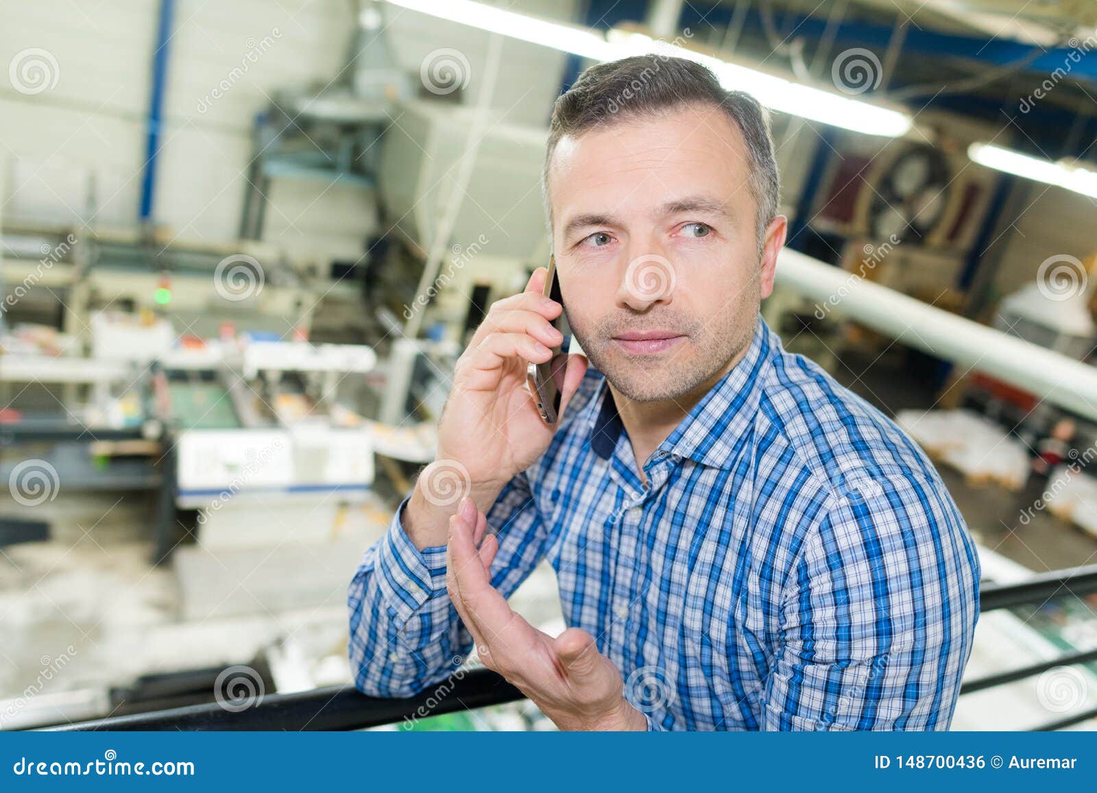 Warehouse Worker Talking on Phone Stock Photo - Image of communication ...