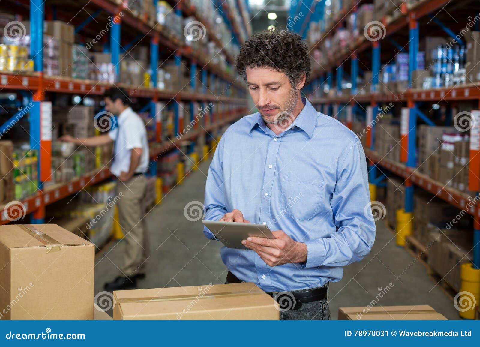 Warehouse Worker Using Digital Tablet Stock Image - Image of mature ...
