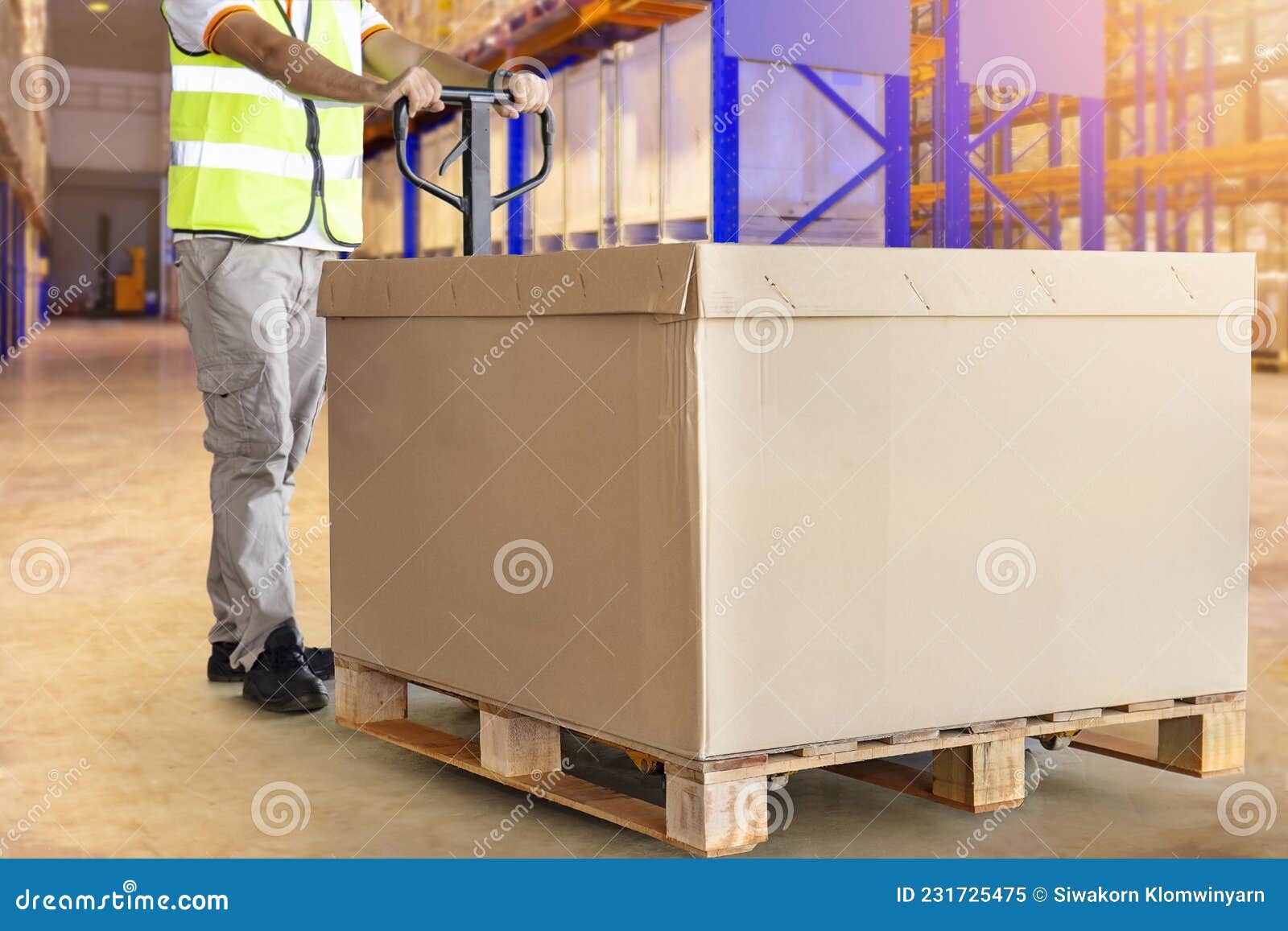 Warehouse Worker Working with Hand Pallet Truck Unloading Pallet Goods ...