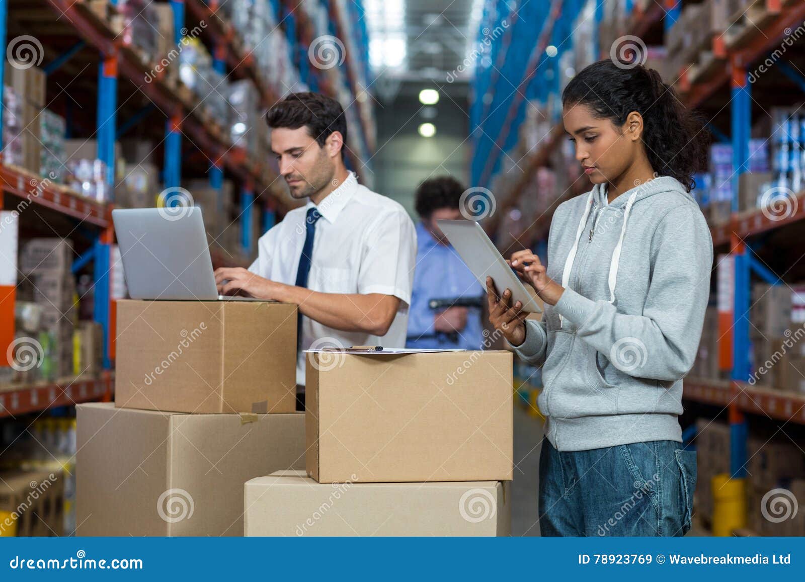 Warehouse Worker Working on Laptop and Digital Tablet Stock Image ...