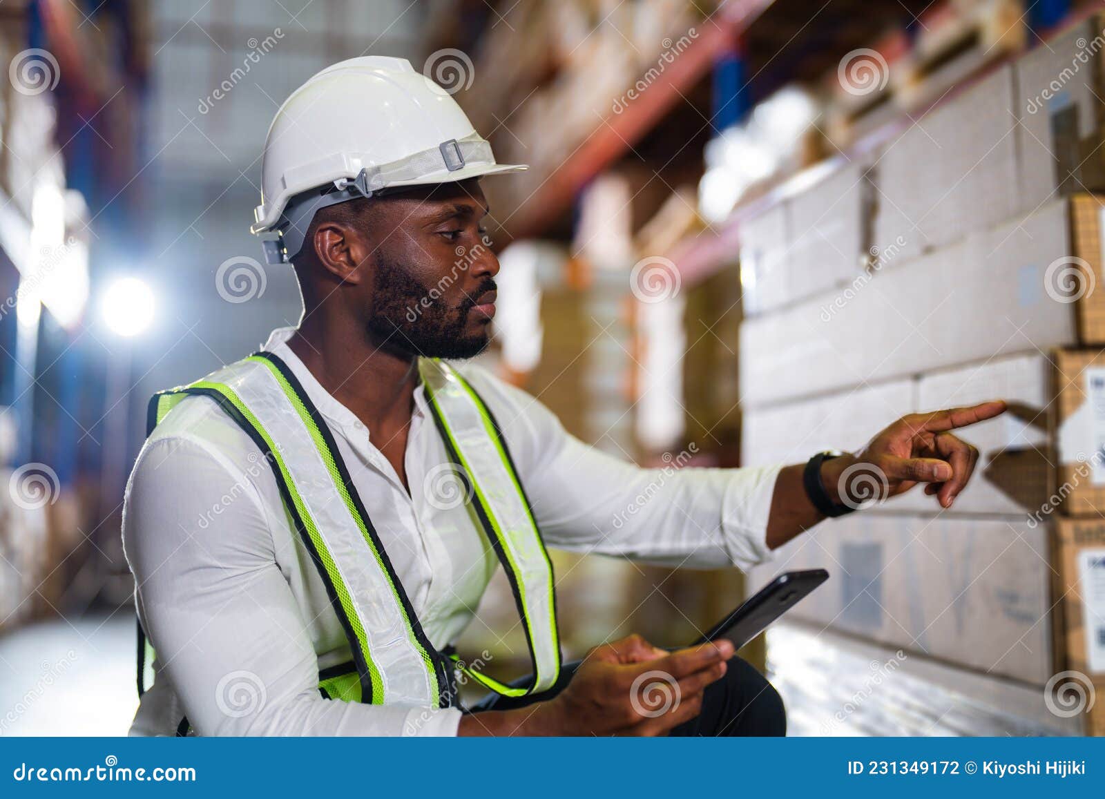 Warehouse Worker Working Process Checking the Package with a Tablet in ...
