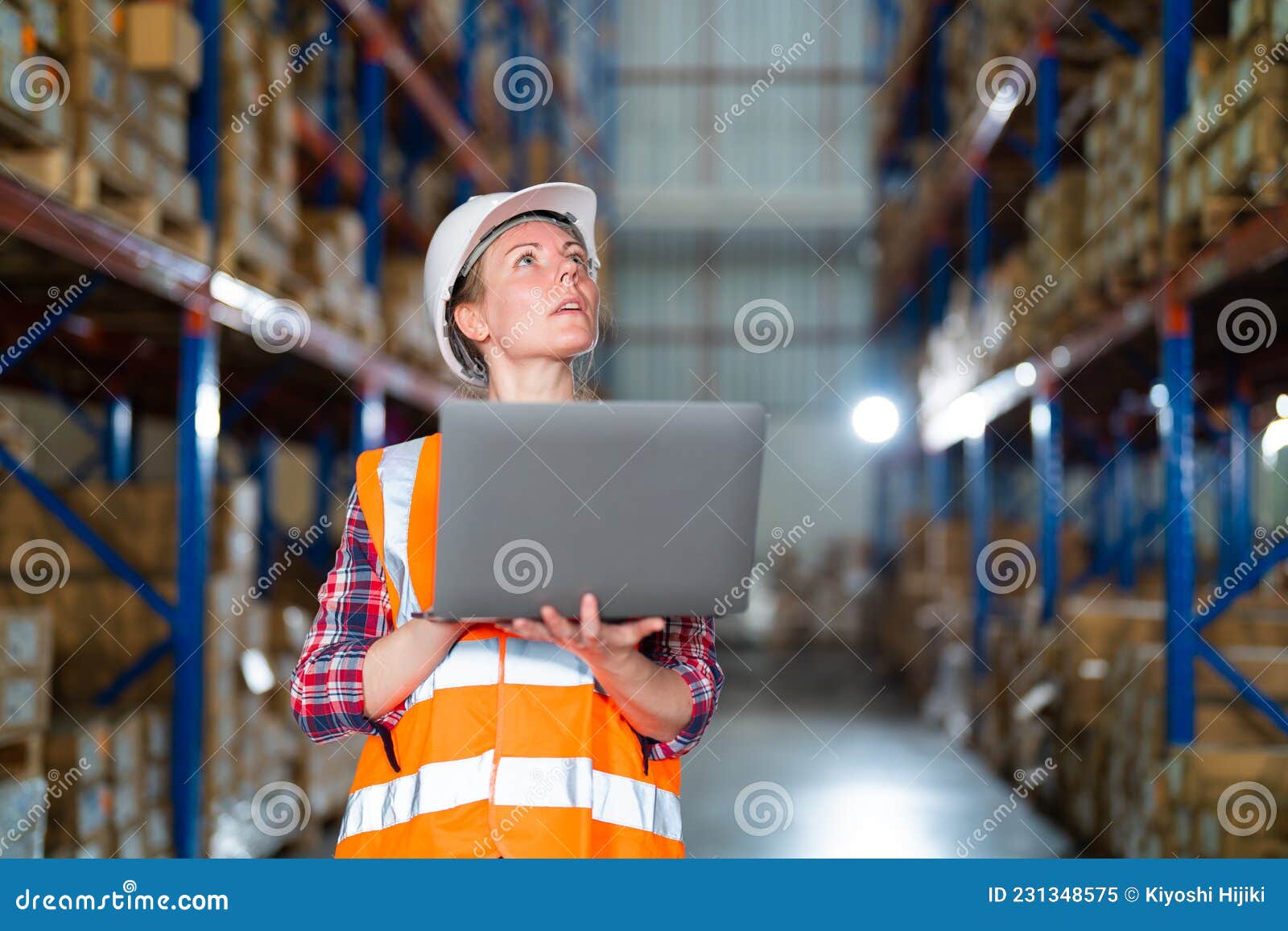 Warehouse Worker Working Process Checking the Package Using Laptop in ...