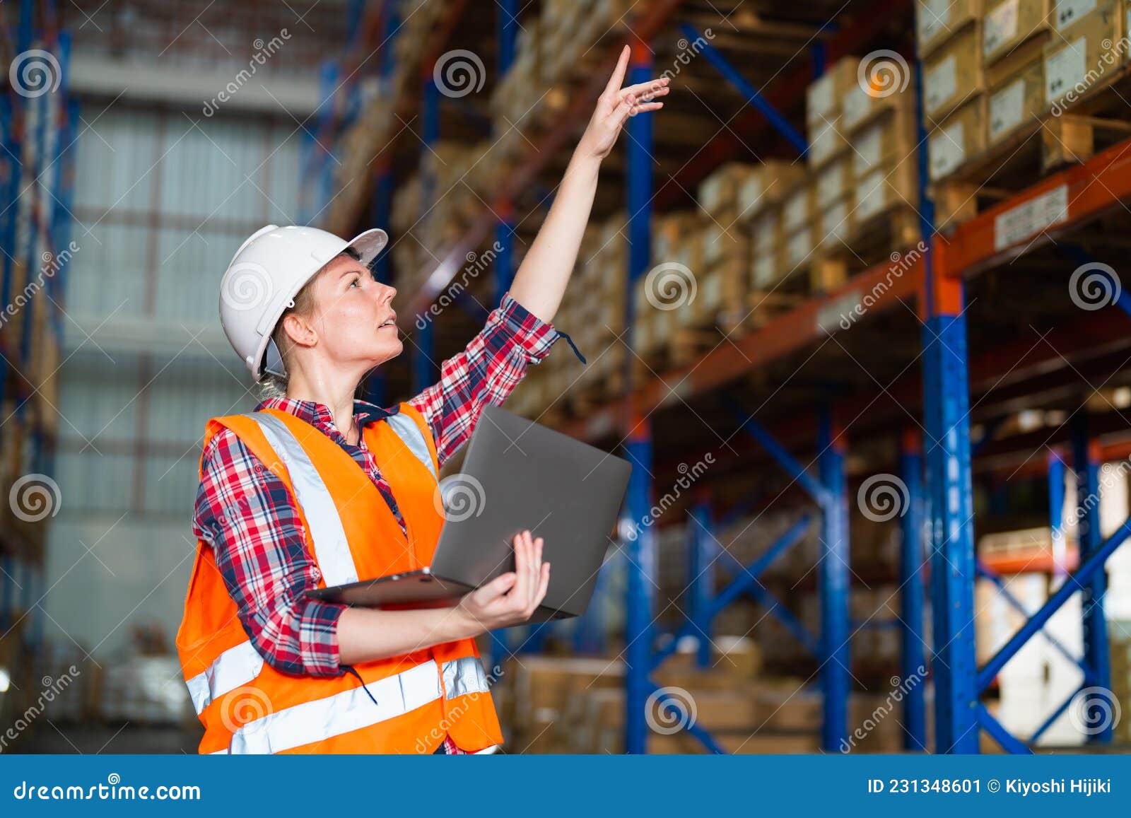 Warehouse Worker Working Process Checking the Package Using Laptop in ...