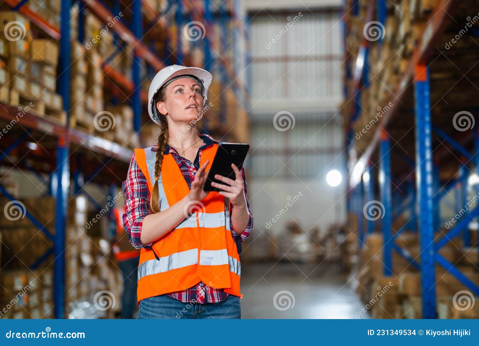 Warehouse Worker Working Process Checking the Package Using a Tablet in ...