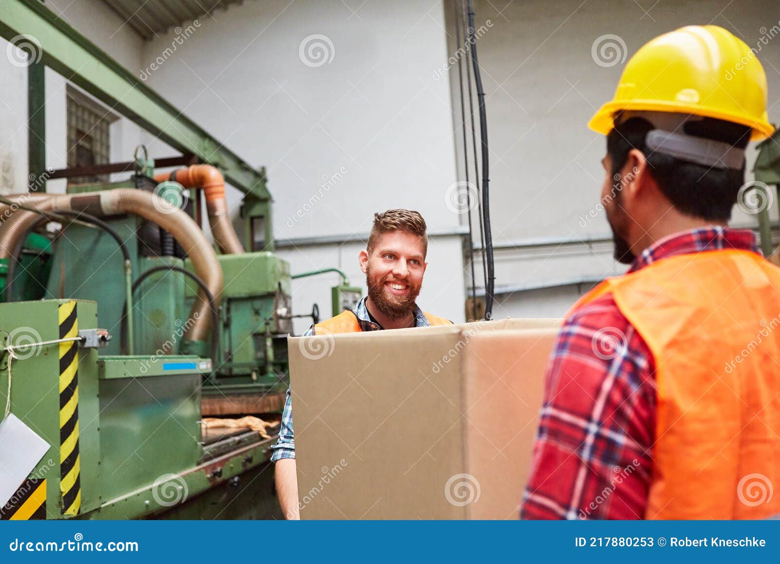 Warehouse Workers Carry Cardboard Boxes with a Material Delivery Stock ...