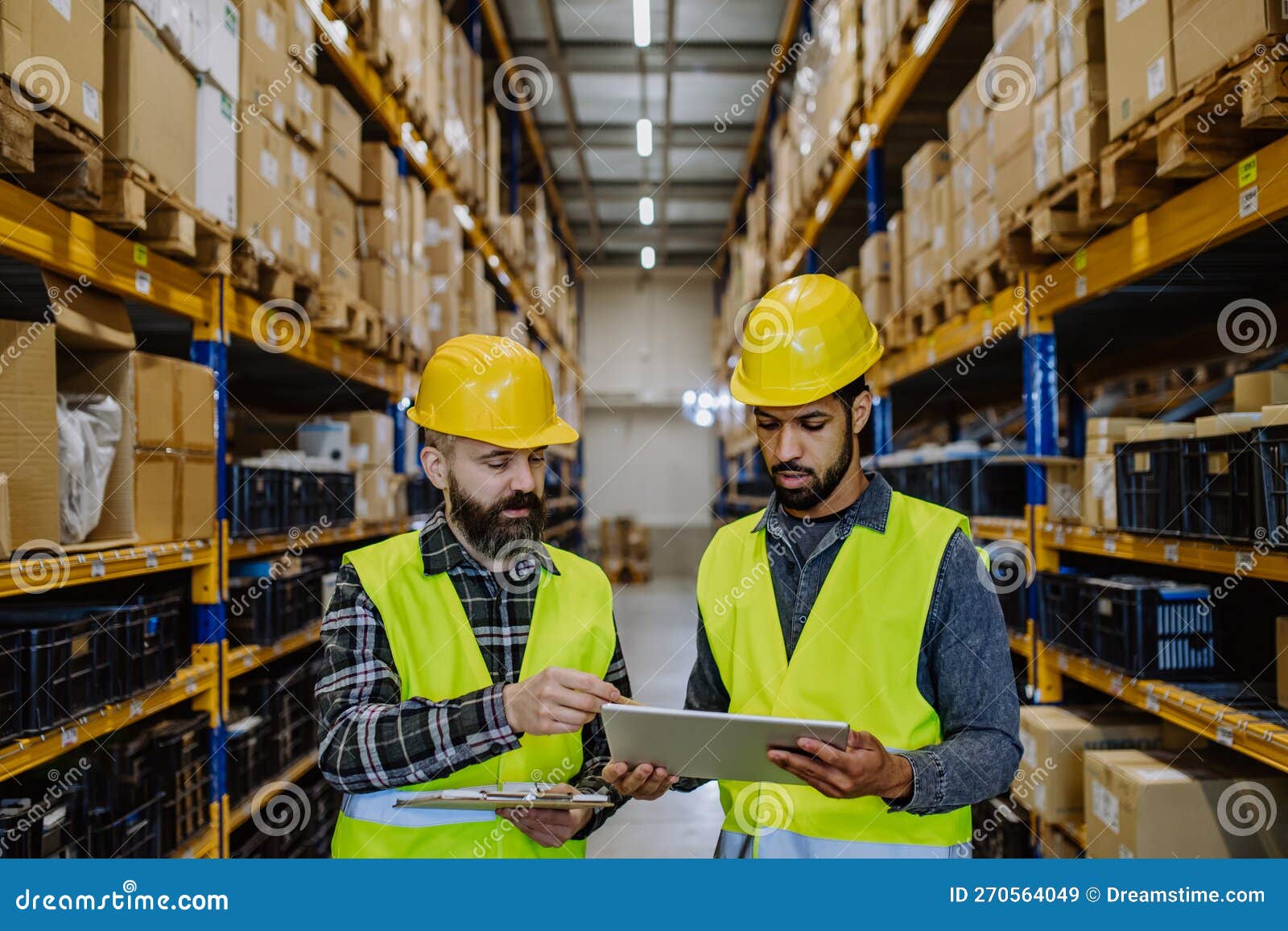 Warehouse Workers Checking Stuff in Warehouse with Digital System in ...