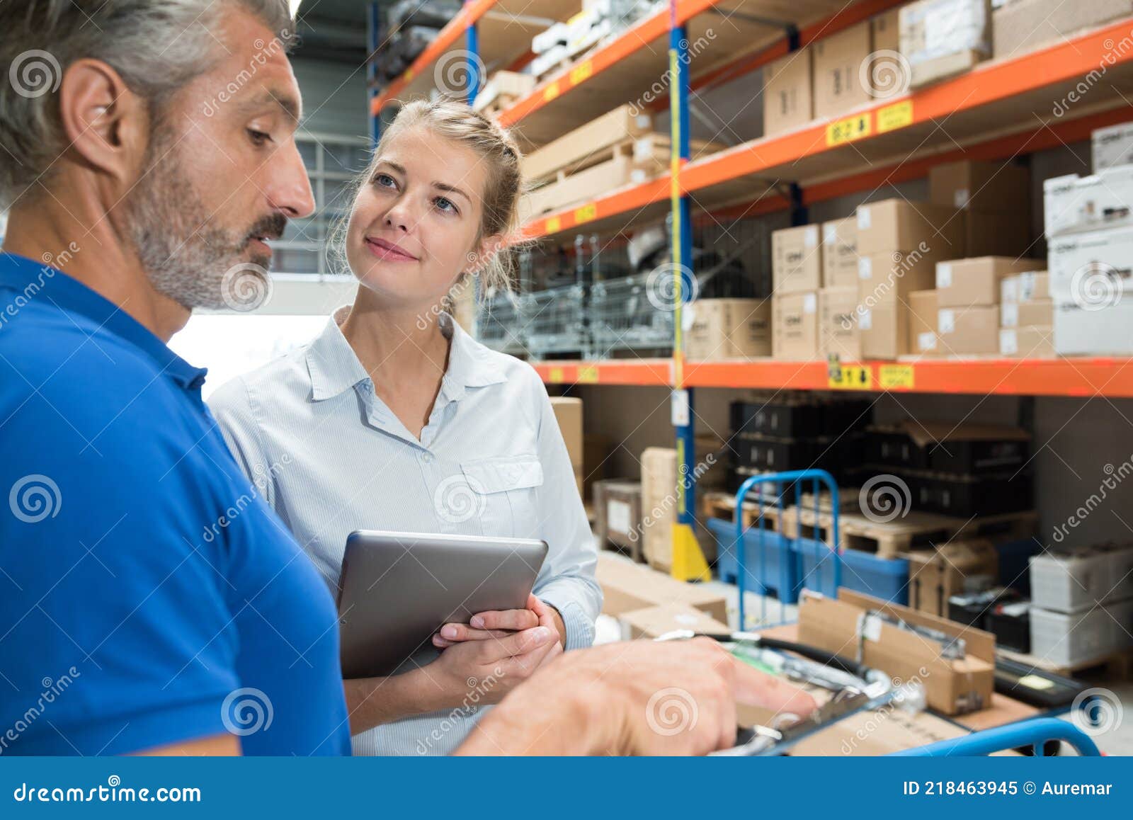 Warehouse Workers in Discussion and Holding Digital Tablet Stock Image ...