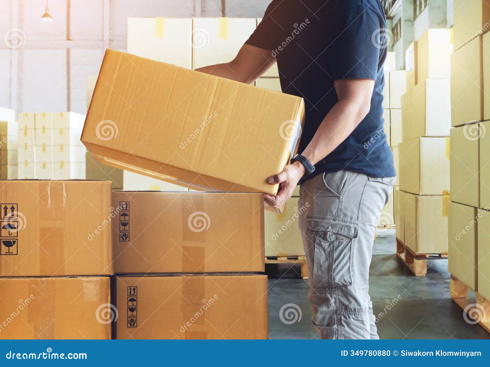 Warehouse Workers Lifting Package Boxes Stack on Pallets. Supply Chain ...