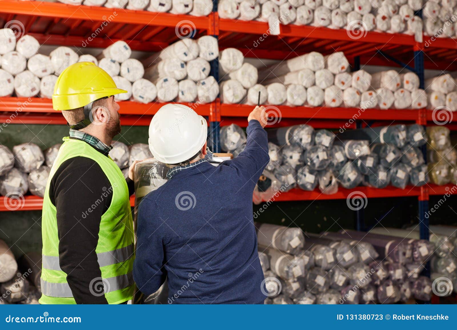 Warehouse Worker in Front of a Shelf in the Carpet Warehouse Stock ...