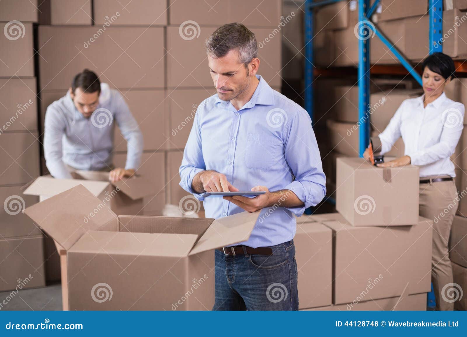Warehouse Workers Packing Up Boxes Stock Photo - Image of mature ...