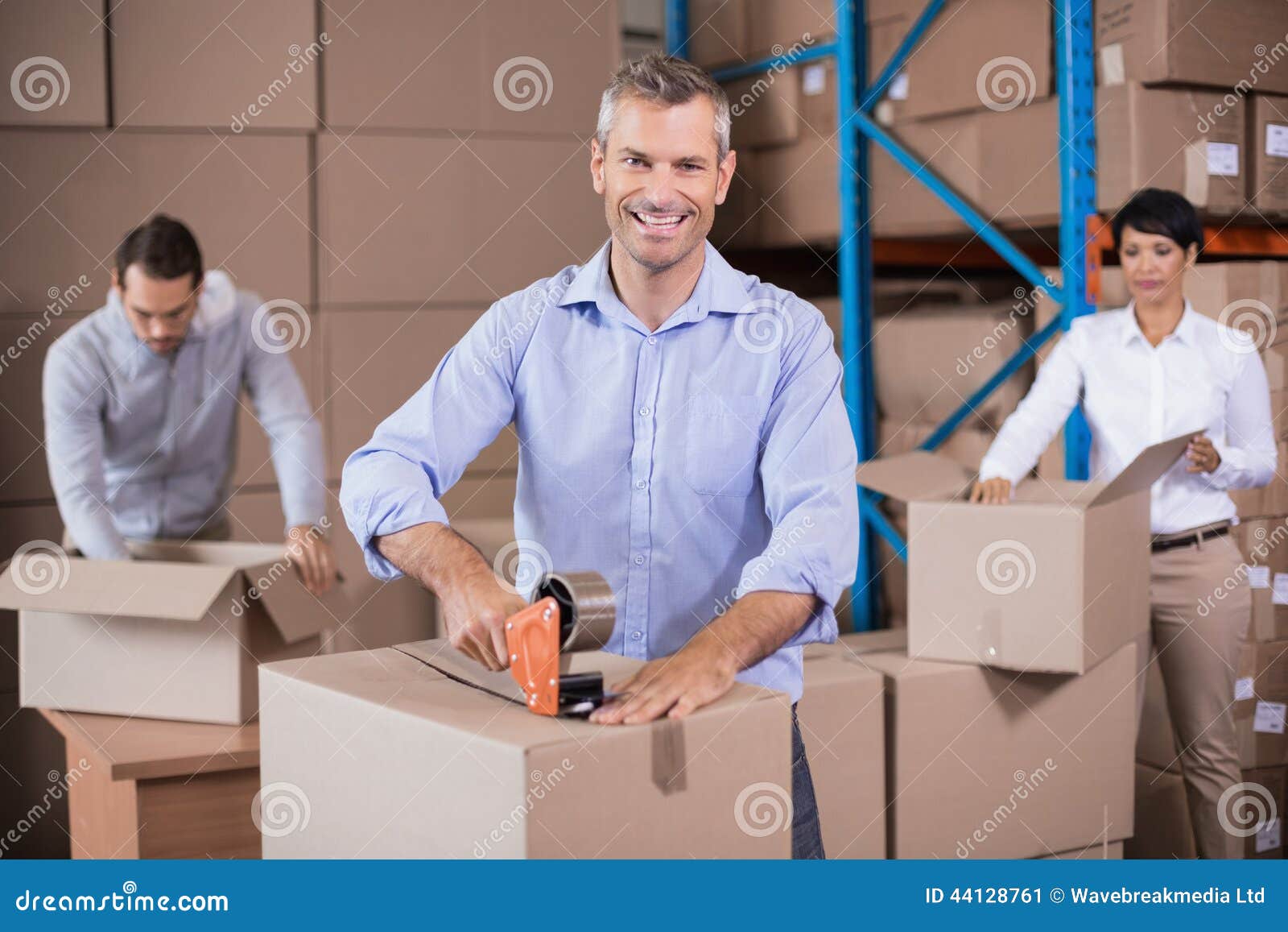 Warehouse Workers Packing Up Boxes Stock Image - Image of mixedrace ...