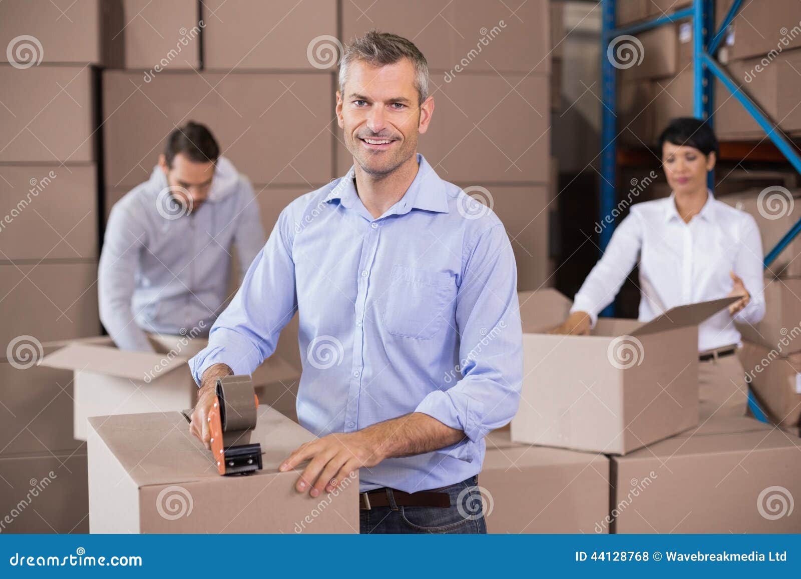Warehouse Workers Packing Up Boxes Stock Photo - Image of young ...