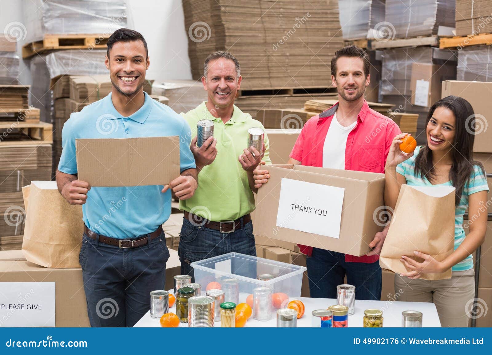 Warehouse Workers Packing Up Donation Boxes Stock Photo - Image of male ...