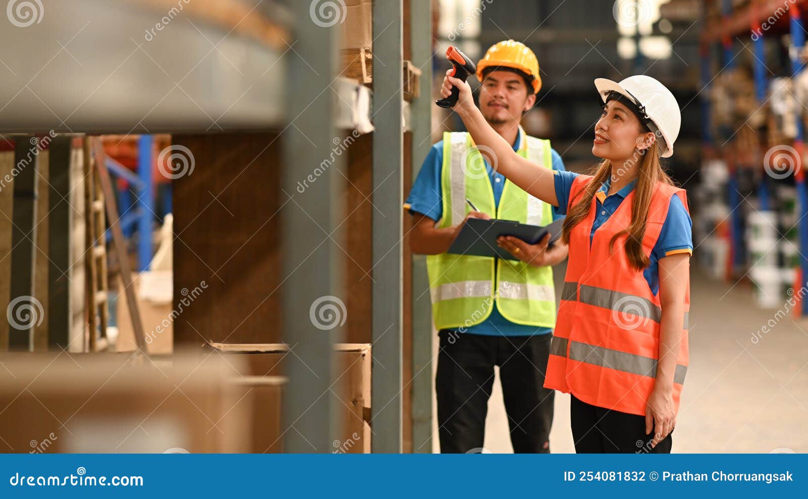 Warehouse Workers in Safety Helmet Working with Barcode Scanner ...