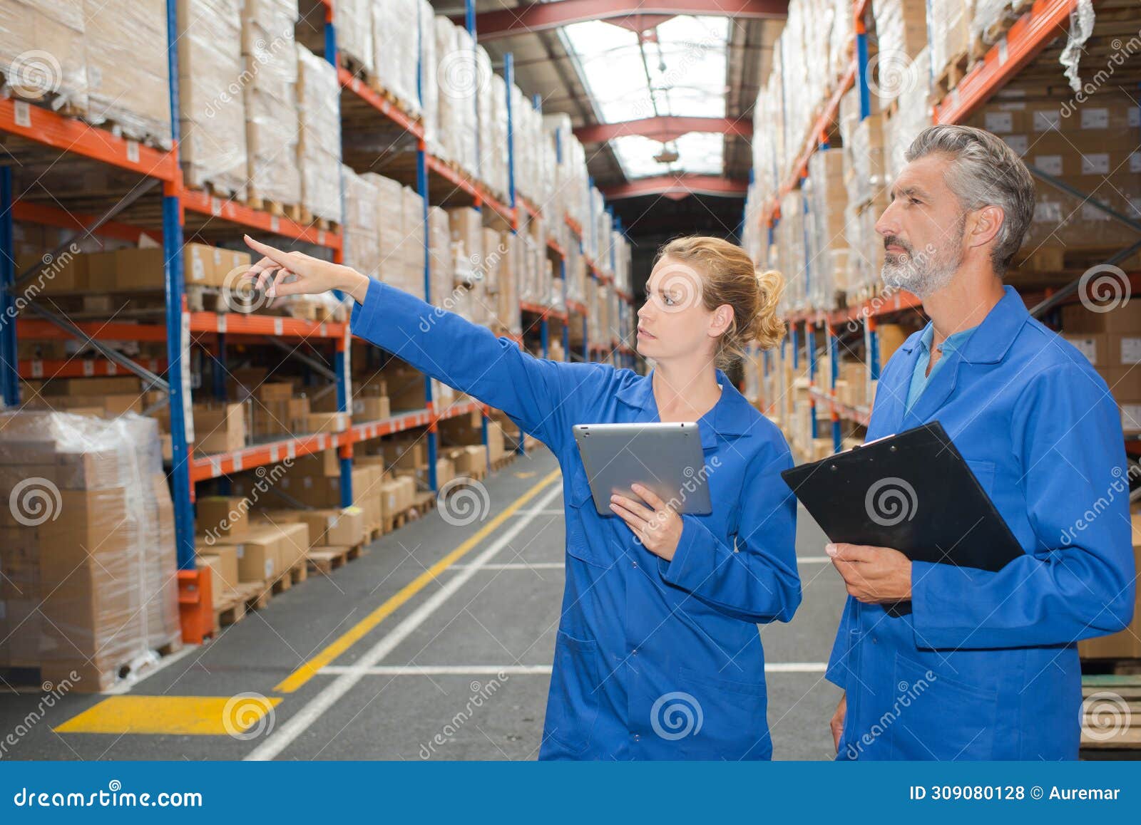 Warehouse Workers Using Tablet Stock Photo - Image of vocation, male ...