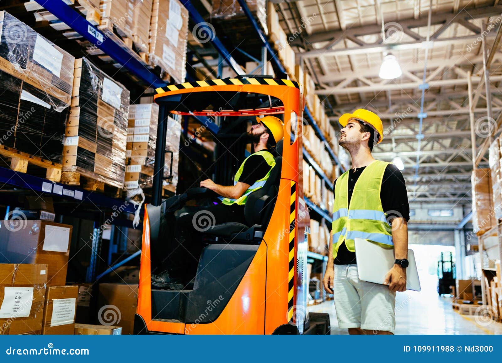Warehouse Workers Working Together with Forklift Loader Stock Photo ...