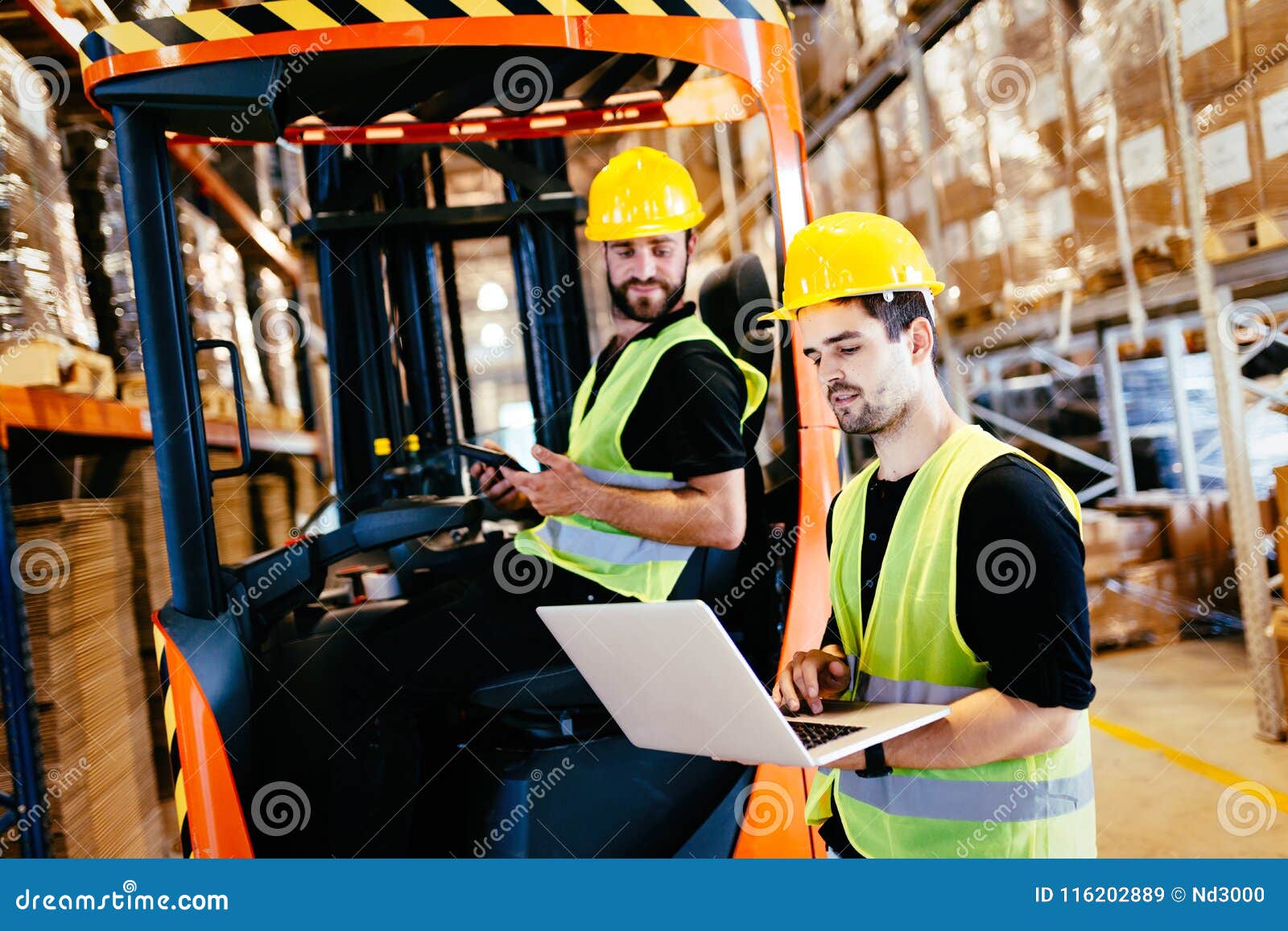 Warehouse Workers Working Together with Forklift Loader Stock Image ...