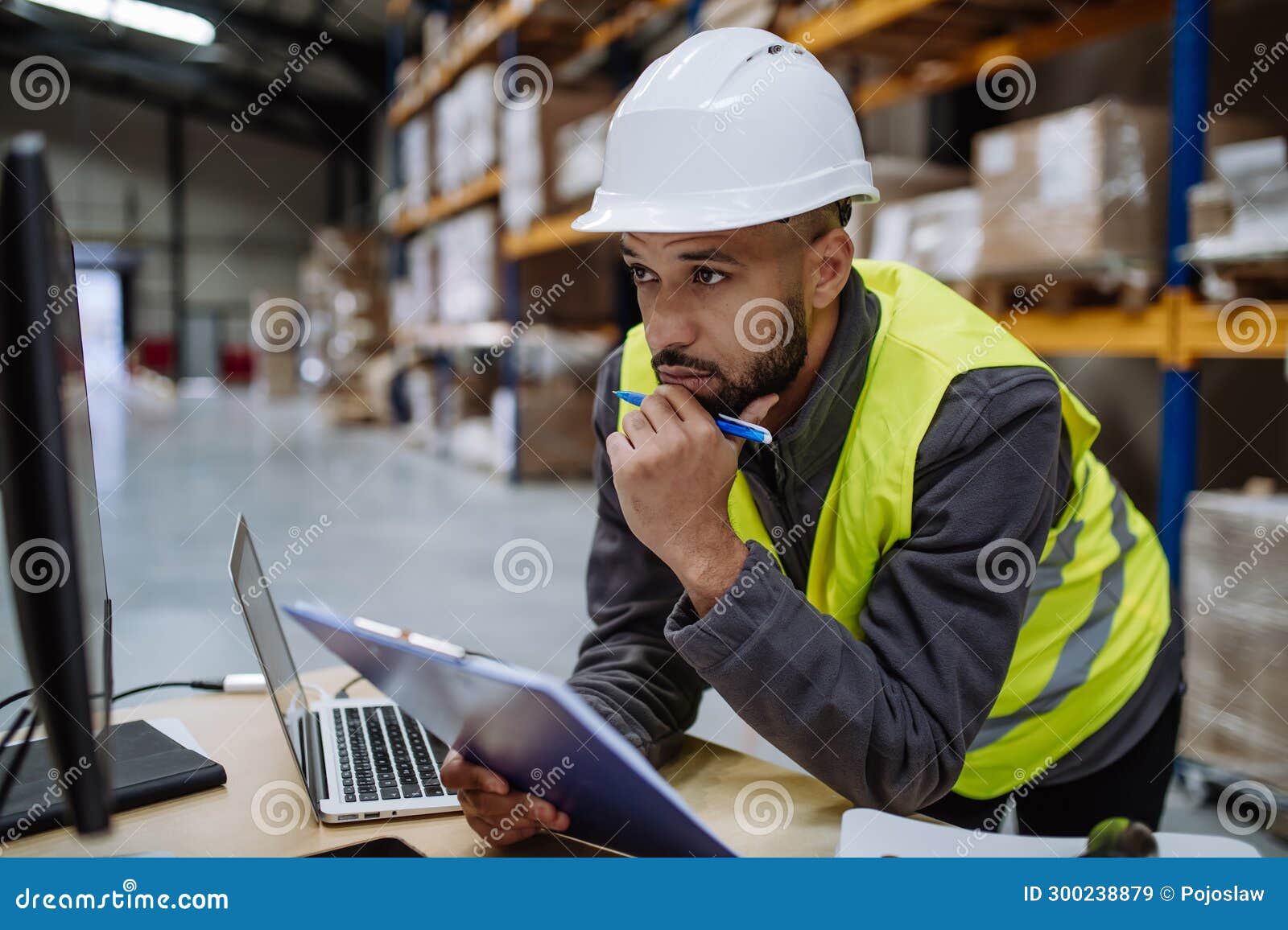 Warehouseman Checking Delivery, Stock in Warehouse on Computer, Pc ...