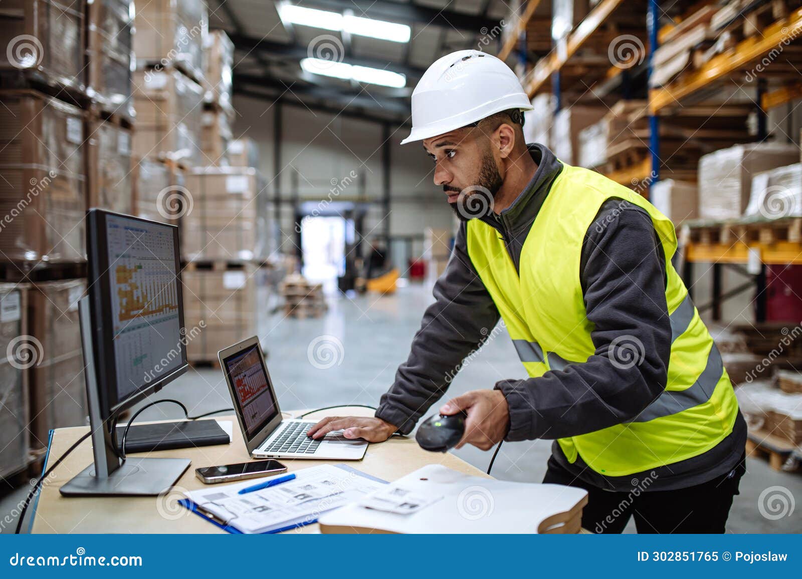 Warehouseman Checking Delivery, Stock in Warehouse on Computer, Pc ...