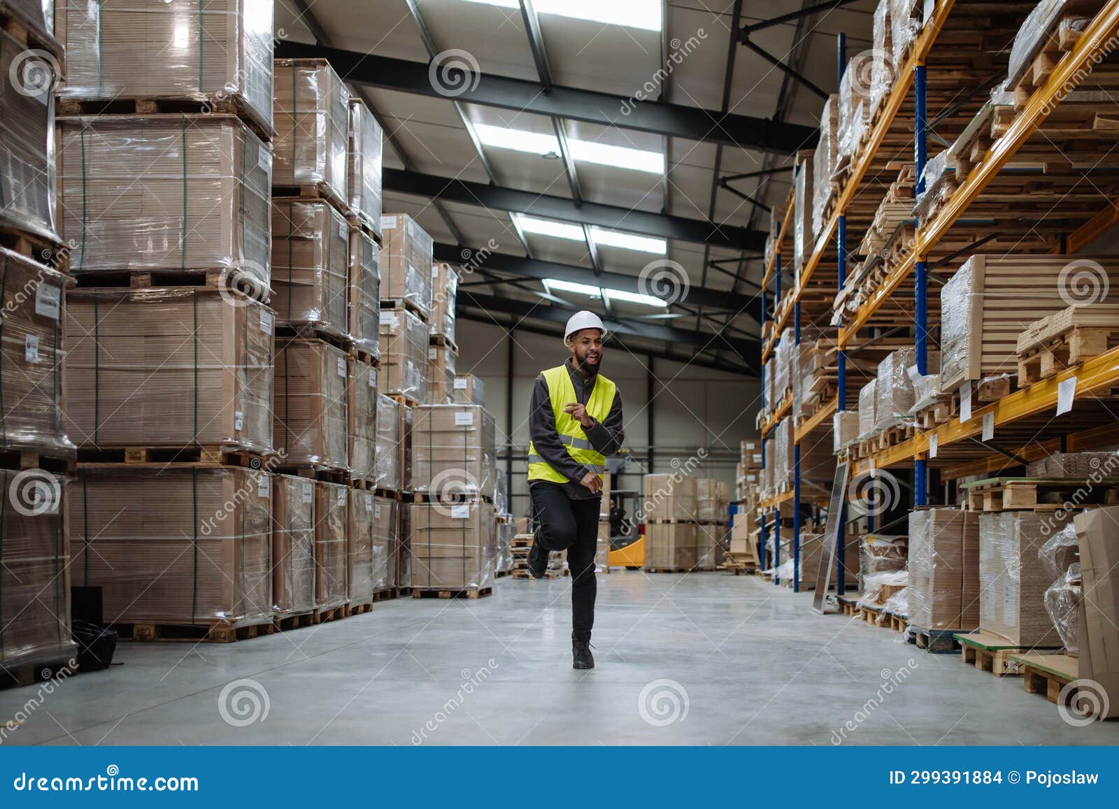 Warehouseman with Tablet Helmet Dancing in the Middle of Warehouse ...