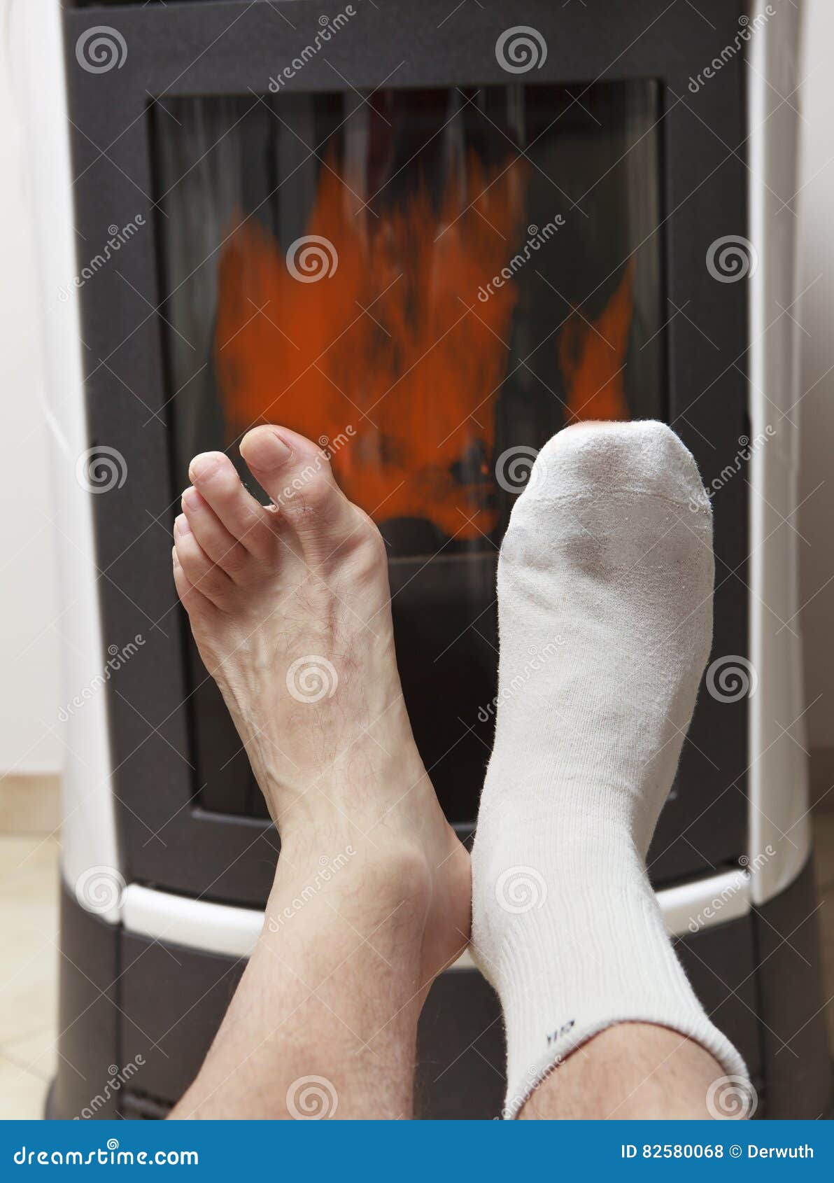 Warm feet in front of fire stock photo. Image of home - 82580068