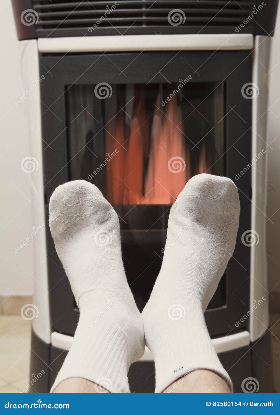 Warm feet in front of fire stock photo. Image of child - 82580154