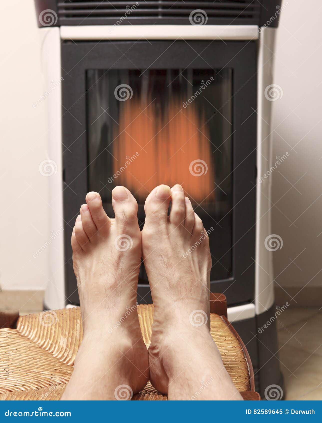Warm feet in front of fire stock image. Image of stove - 82589645