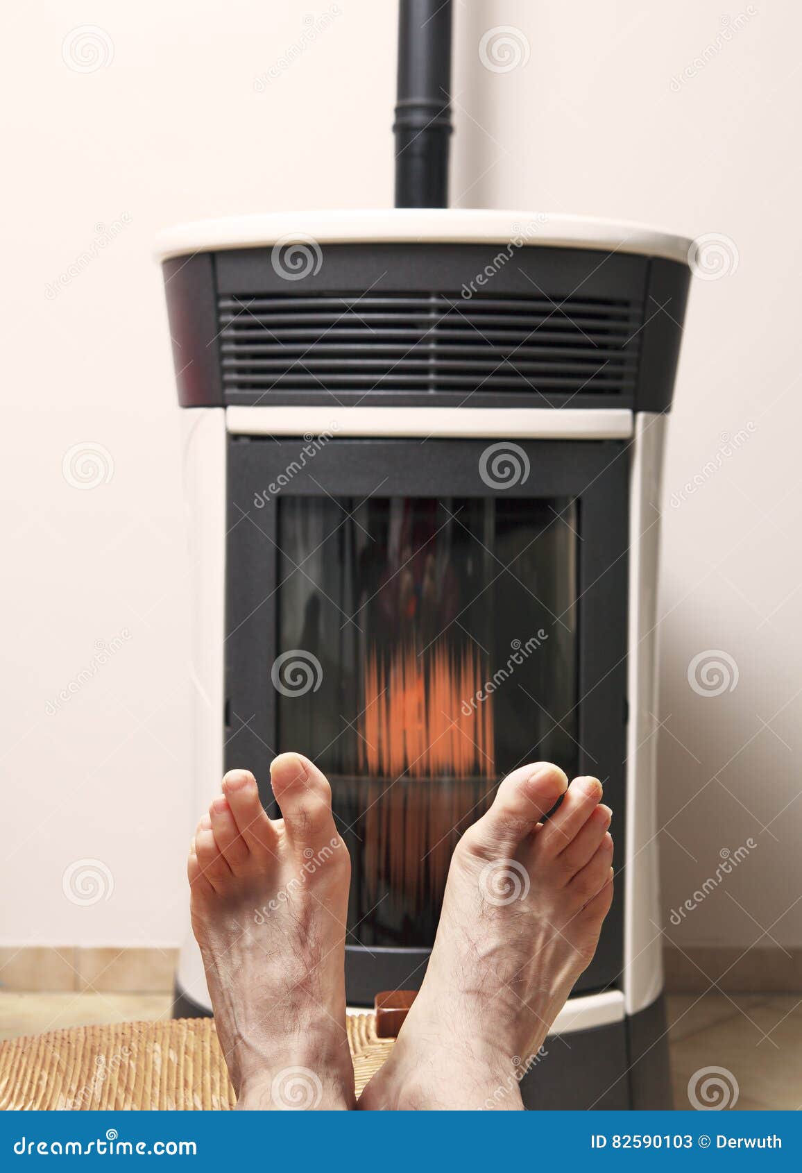 Warm feet in front of fire stock image. Image of fireplace - 82590103
