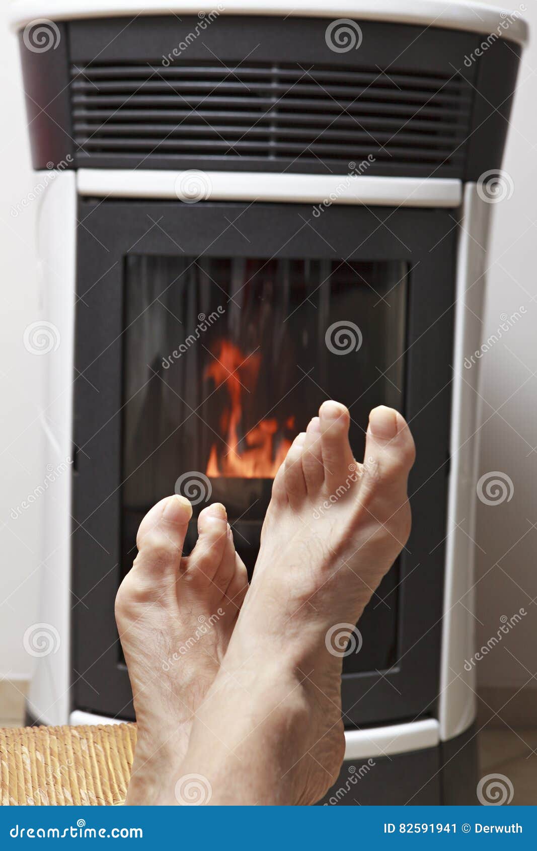 Warm feet in front of fire stock image. Image of front - 82591941