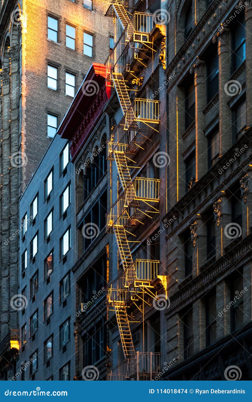 Warm Glow of Sunlight Shining on a Fire Escape on the Front of a Stock ...